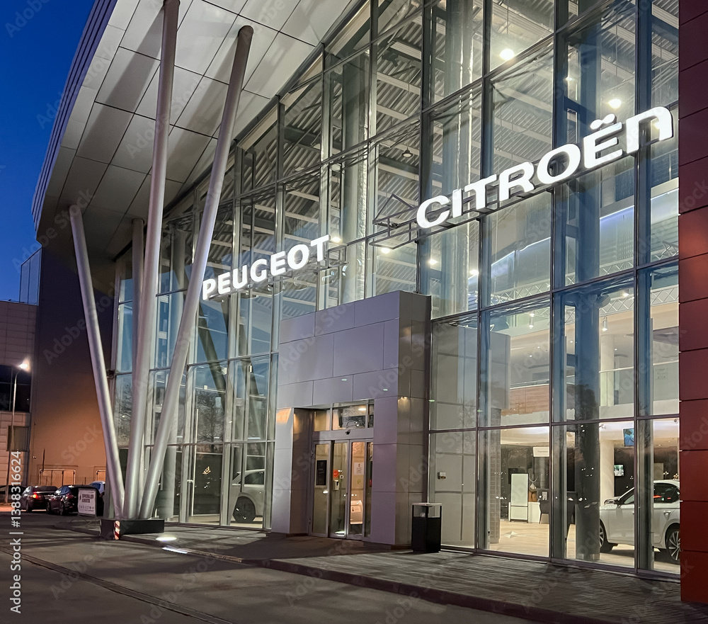 Dealer store Peugeot, Citroen at night. French car manufacturers ...