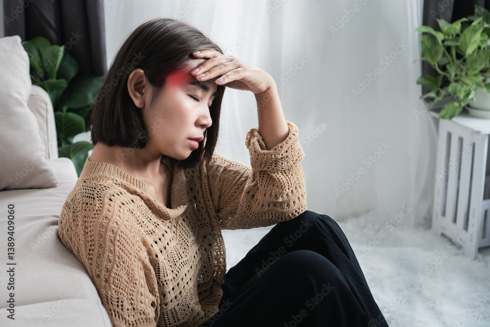 asian woman holding her right temple in pain, experiencing tension or ...
