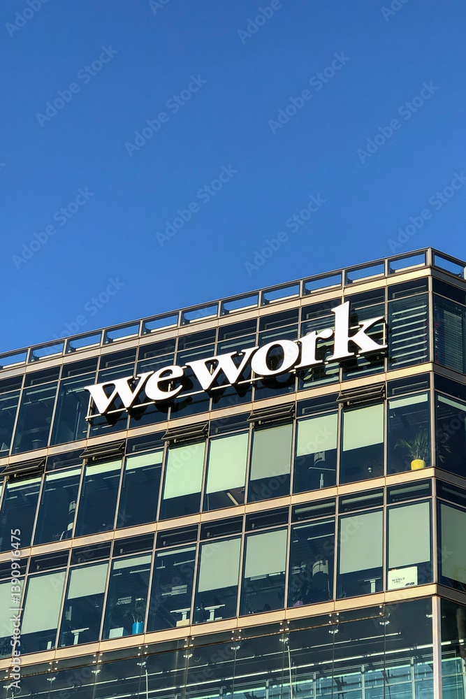 WeWork logo sign on an office building on Potsdamer Platz, provider of ...