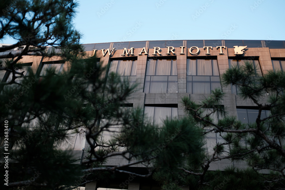 JW Marriott Hotel Building with Pine Tree Silhouettes in Seoul, South ...