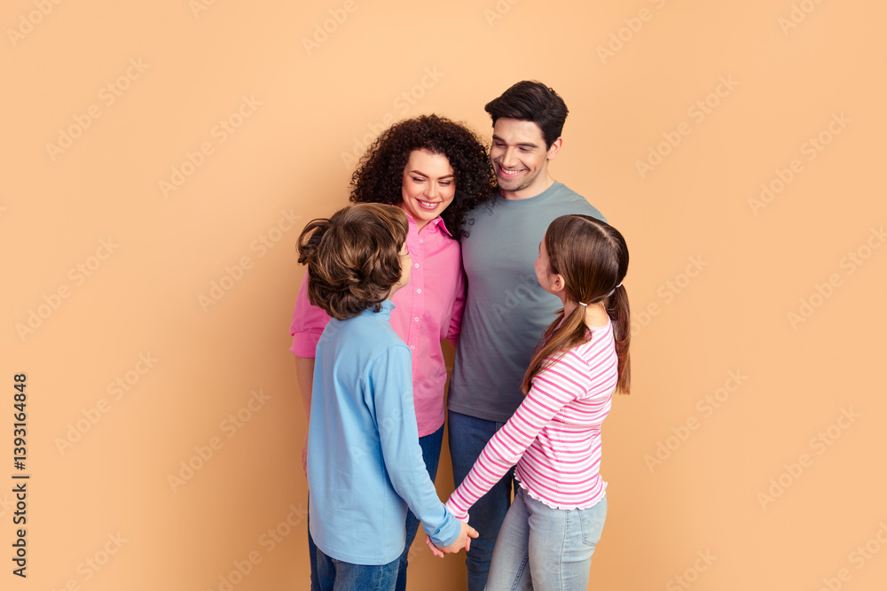 Happy family enjoying a joyful bonding moment together on a beige ...