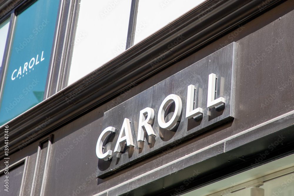 caroll storefront sign logo and brand text of clothing store facade ...