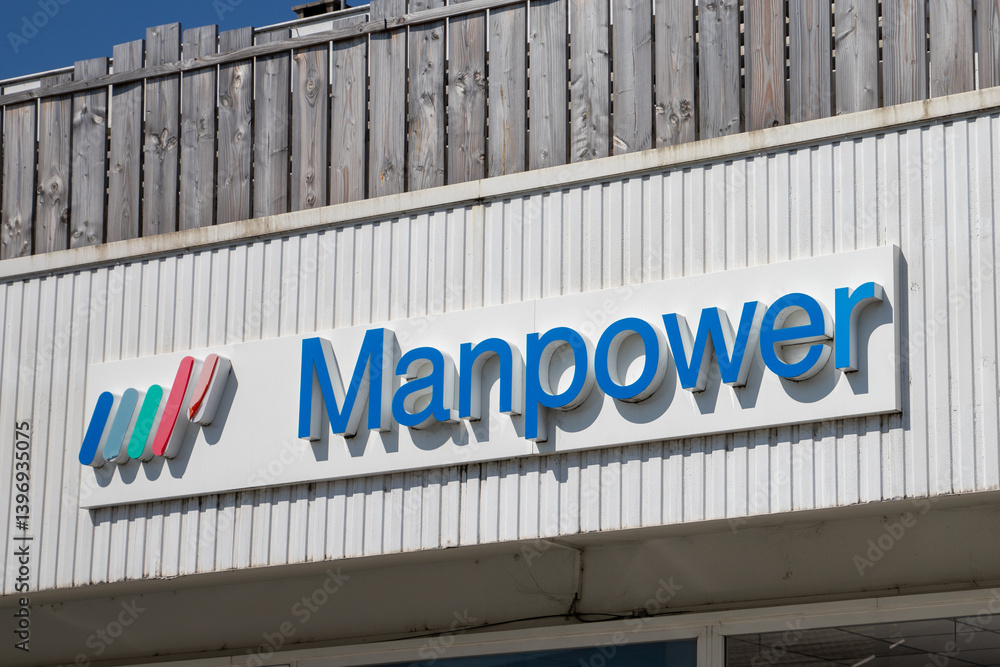 manpower chain sign brand and text logo on chain wall entrance facade ...