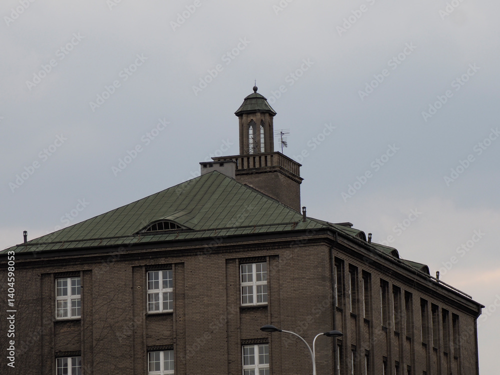 Historic Brick Building with Green Roof and Bell Tower Cupola Under ...
