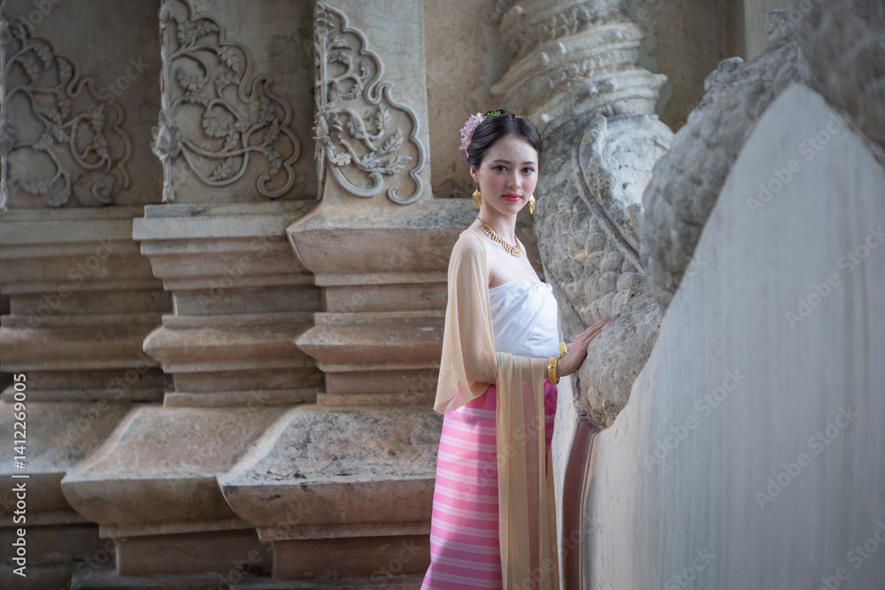 Beautiful young Asean woman in traditional Thai Dvaravati dress in an ...