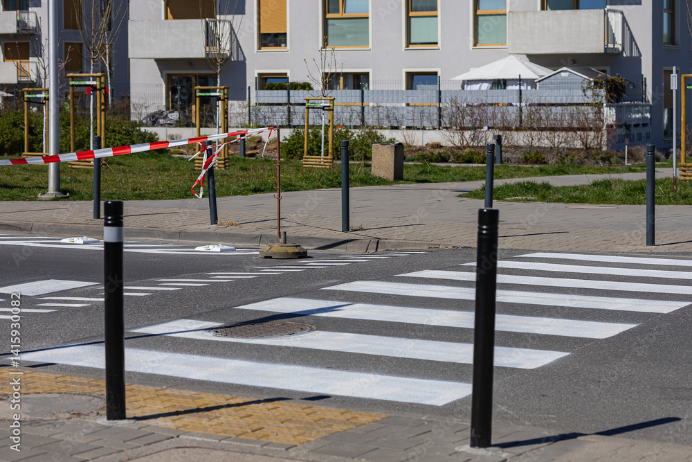 Newly renovated pedestrian crosswalk in modern residential area with ...