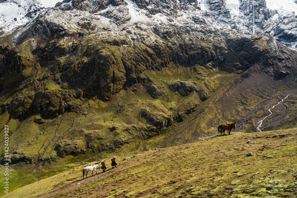 Native Americans leading horses up a snowy mountain path in the ...