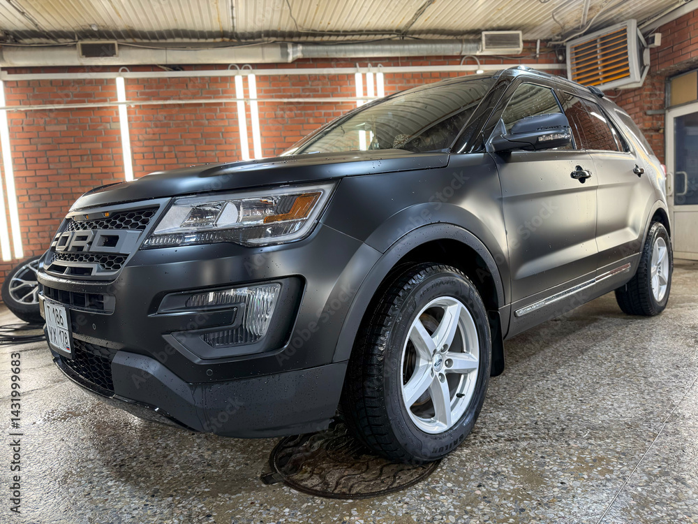 Ford Explorer 4x4 black matte color on the parking. Exterior Ford ...