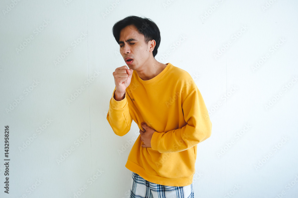 Asian man suffering from sore throat and cough, looking sick and ...