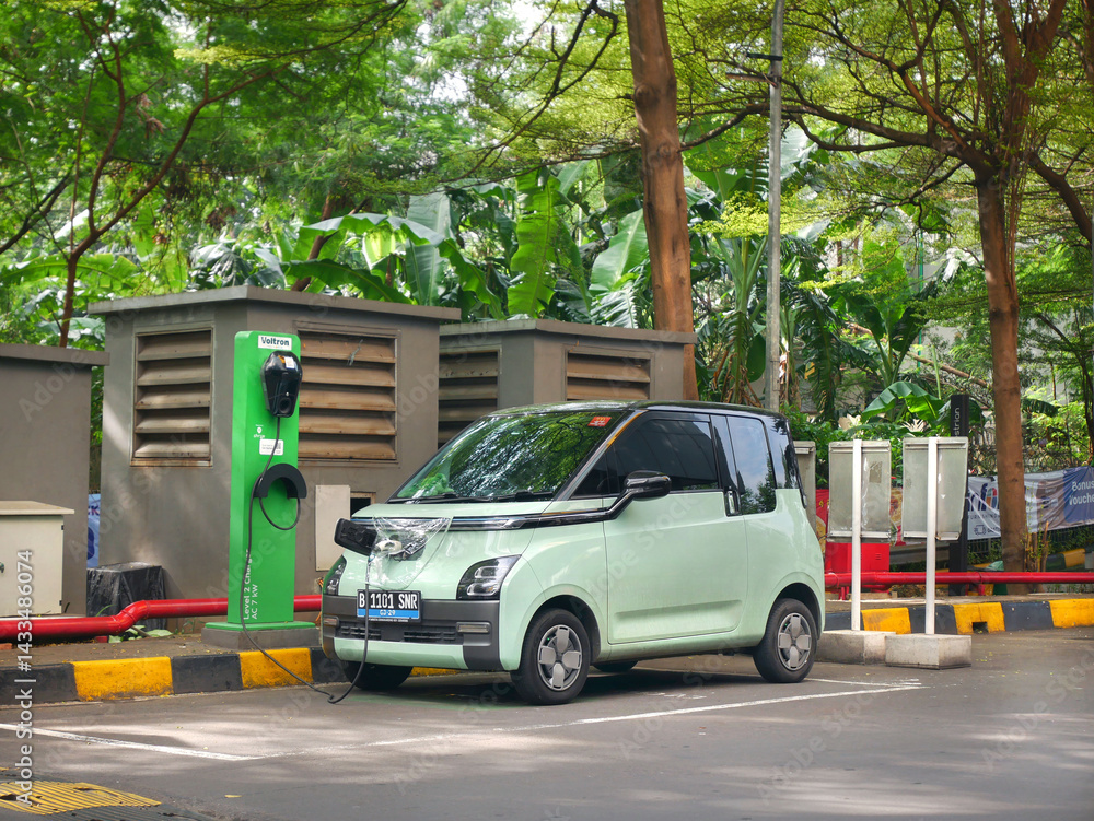 Wuling EV car charged at EV car charging station at shopping mall ...