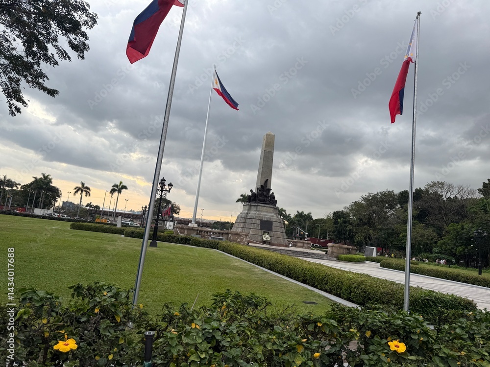 February 2025 - Luneta Park, Manila Philippines: Jose Rizal Monument Luneta Park with Philippine ...