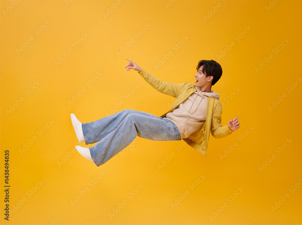 Foto Happy smiling asian man relaxing floating in mid-air and hand ...