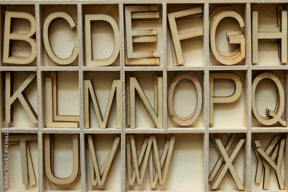 Wooden English alphabet letters arranged in cells, alphabet letters in ...