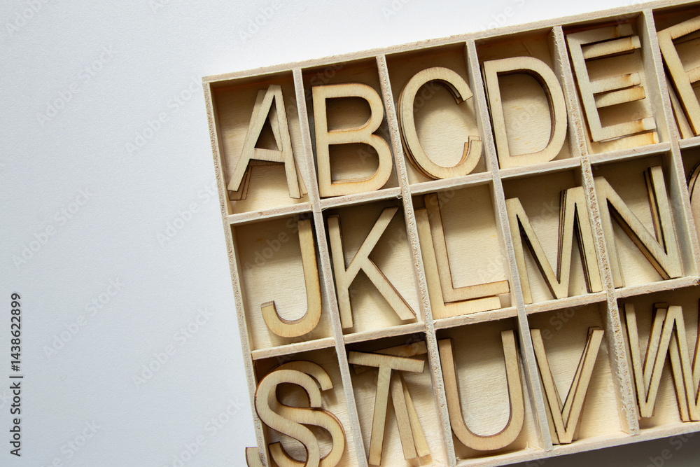 Wooden English alphabet letters arranged in cells, alphabet letters in ...