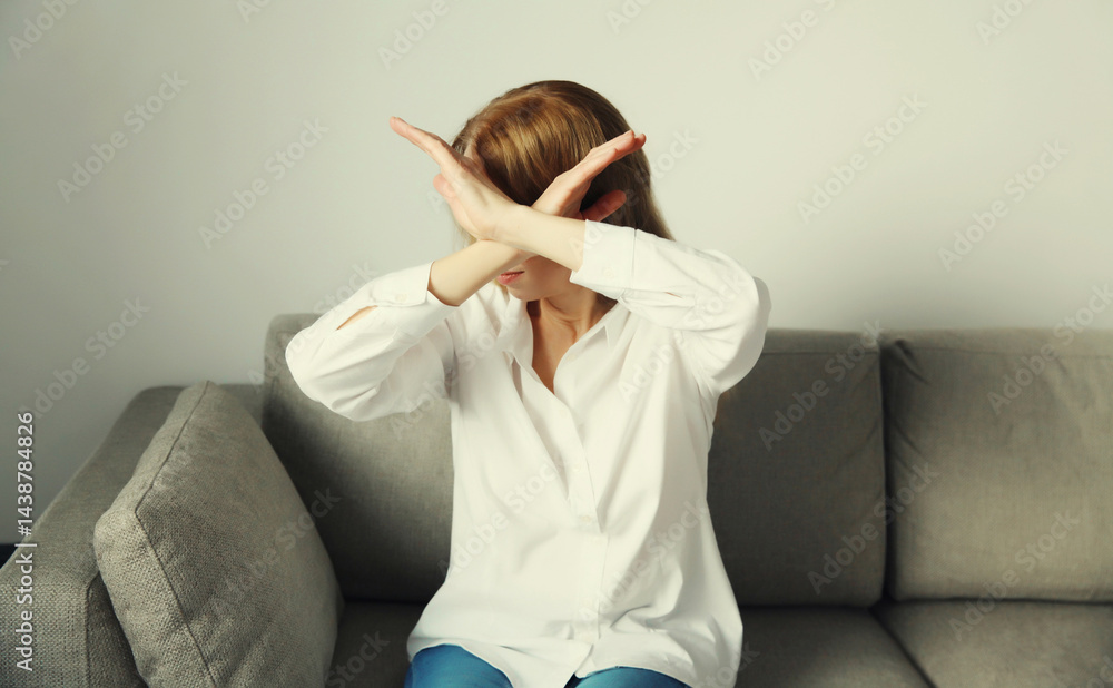 Woman shows stop, no or enough sign with palm of hand, refusal gesture ...