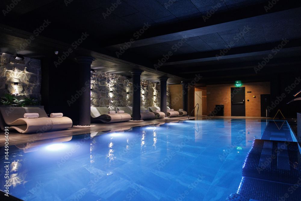Beautiful dark interior of luxury modern spa club with swimming pools ...