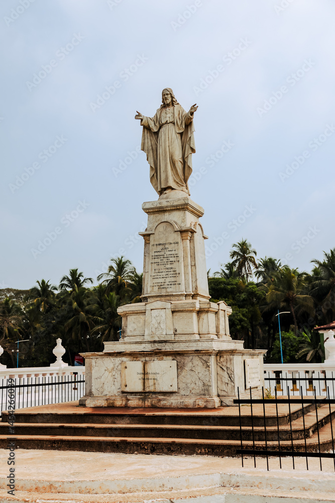 Goa, India - February 20, 2025: The statue of Jesus facing the Se ...
