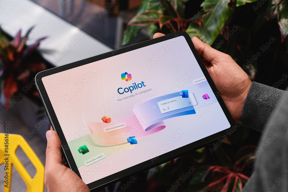 Foto de Stock Office worker using microsoft copilot on a tablet for ...
