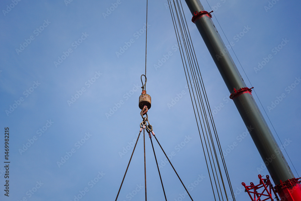 Crane operation during lifting a heavy object by wire rope sling ...
