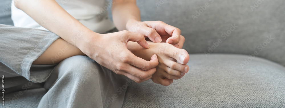 Foot pain, ache asian young woman hand scratch feet, itch foot, problem ...