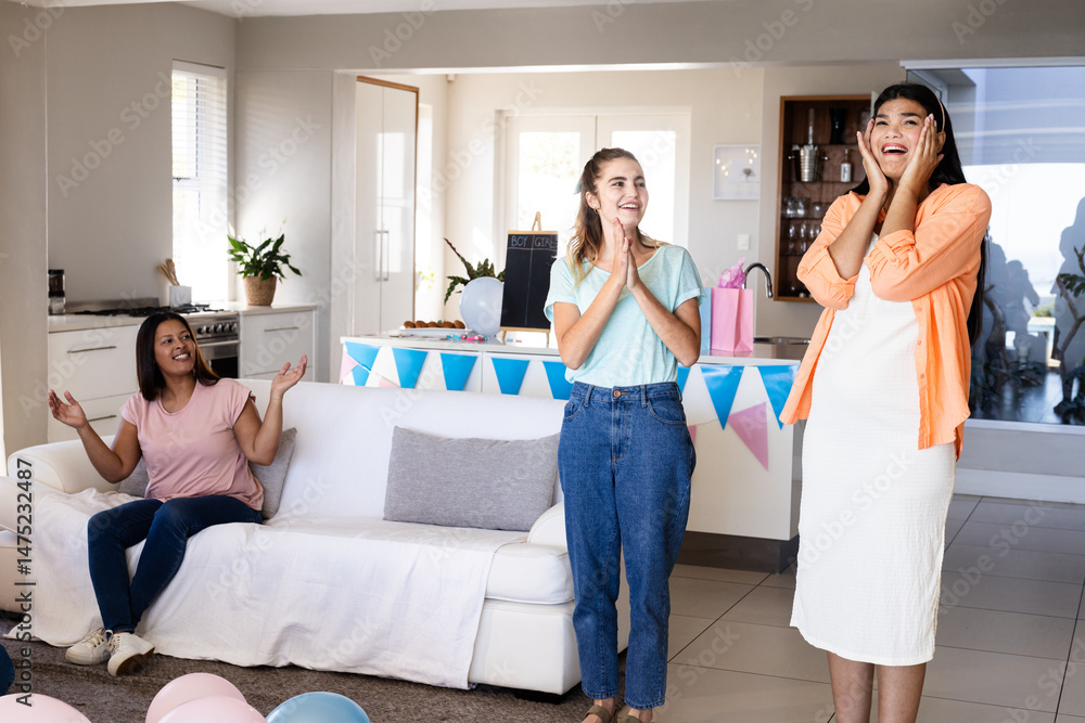Women celebrating surprise party at home, smiling and clapping with joy ...