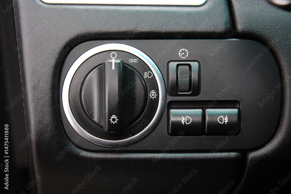 Closeup image of lux car lighting control switch. Light switch on the ...