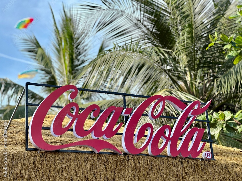 Foto de Stock Coca Cola logo under palm trees in Vietnam | Adobe Stock