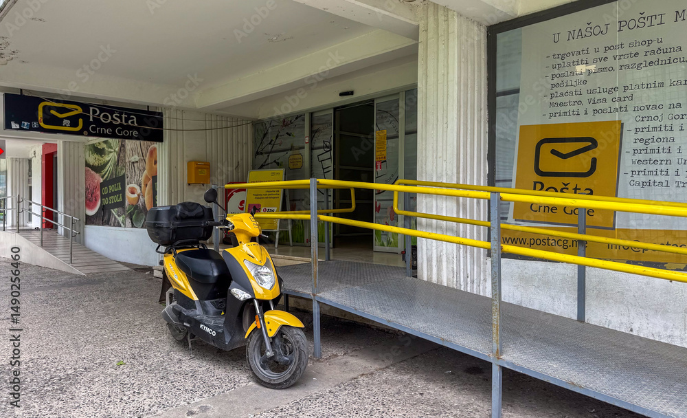 Budva, Montenegro - May 11, 2025: Yellow delivery scooter parked ...
