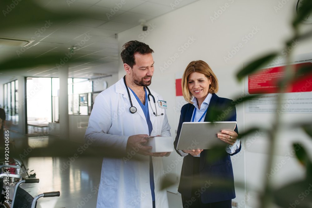 Confident female medical sales representative introducing ...