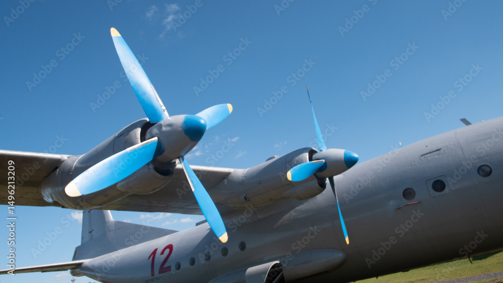 A close look at a vintage Soviet aircraft with blue propellers ...