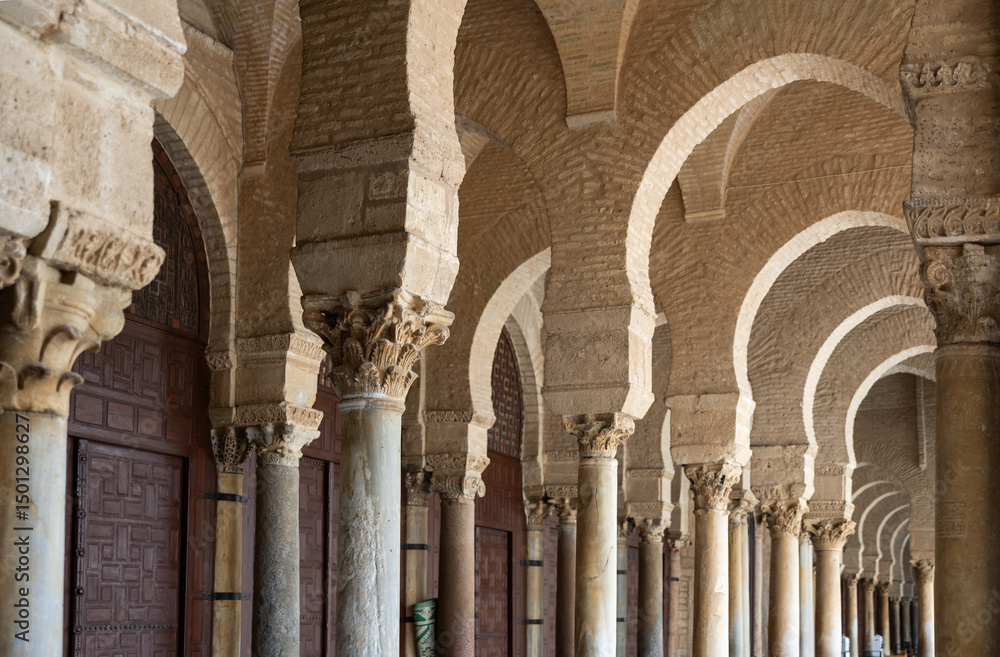 Long narrow passages under arches of temple, courtyard of great Mosque ...