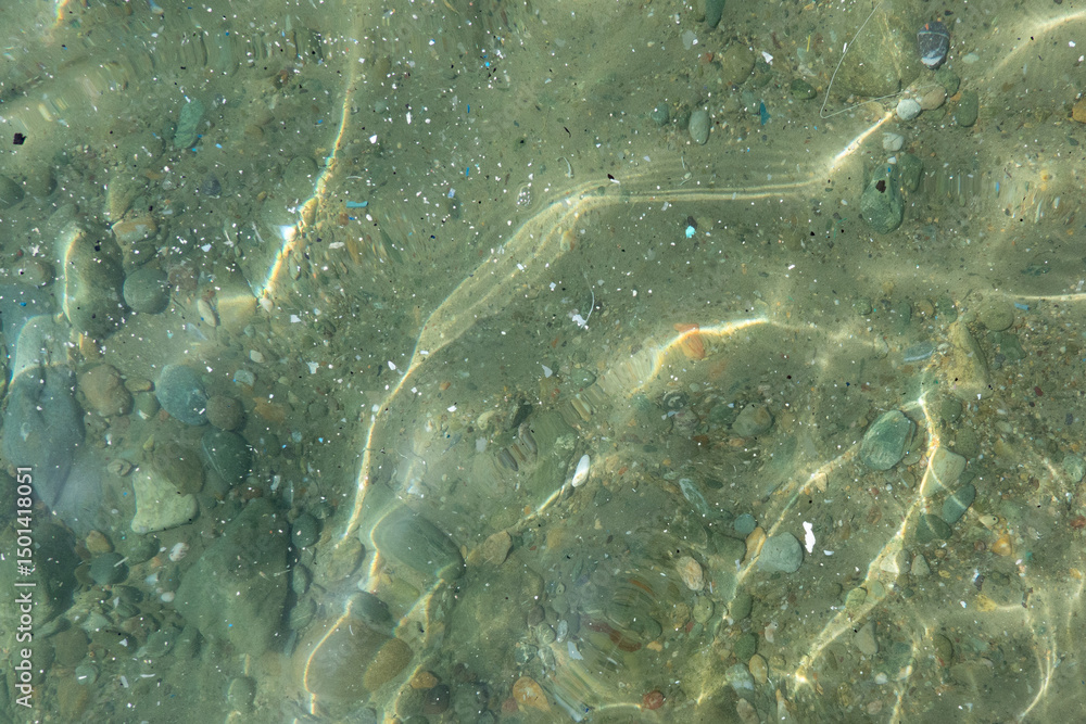 Plastic soup; large amount of small plastic pieces floating in the ...