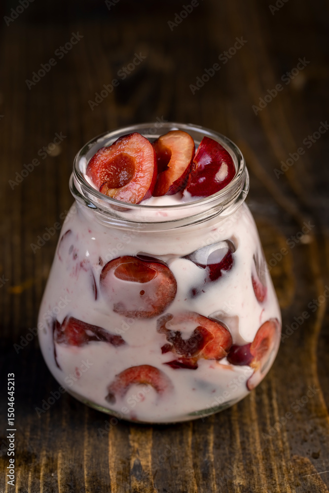 yogurt with cherry flavor , jar with cherry yogurt with fresh red ...