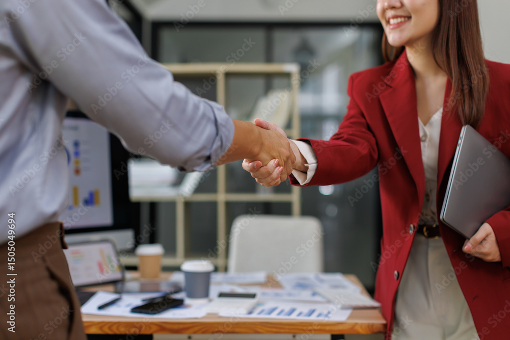Happy young business woman asian manager handshaking client at meeting ...
