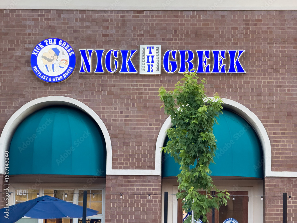Nick the Greek Restaurant Storefront with Blue Sign and Arched Windows ...