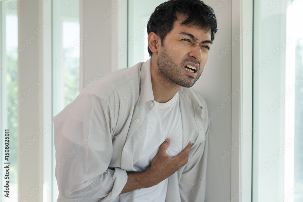 Стокове фото hand hold chest with heart attack symptoms, man working ...