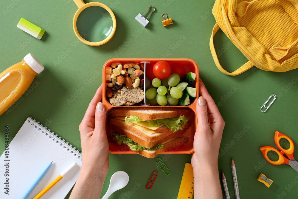 Healthy school lunch box: nutritious meal with sandwich, fruits, and ...