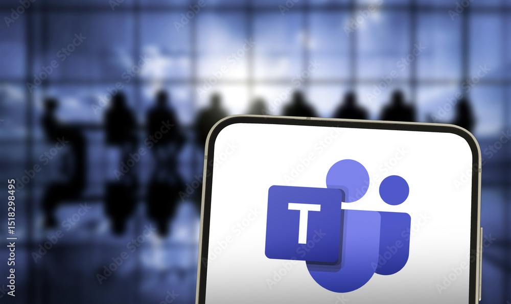 Foto Mobile device displays the Microsoft Teams logo on the screen do ...
