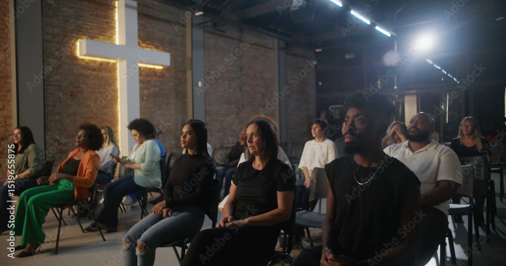 Congregation sitting during church service, listening attentively with ...