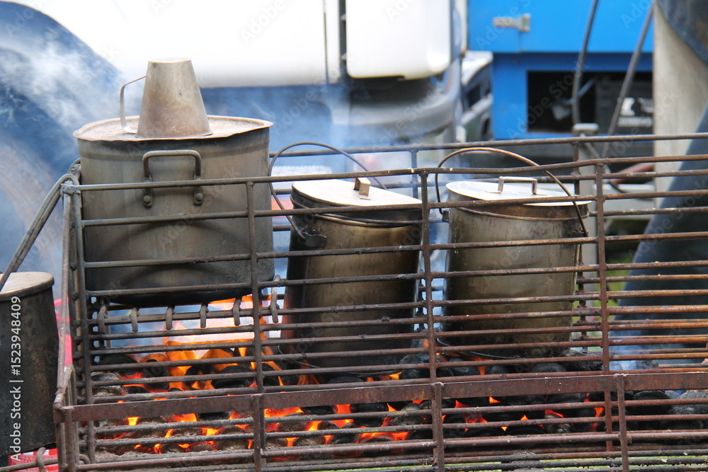 Large Food Cooking Pots on an Open Air Coal Fire. Stock Photo | Adobe Stock