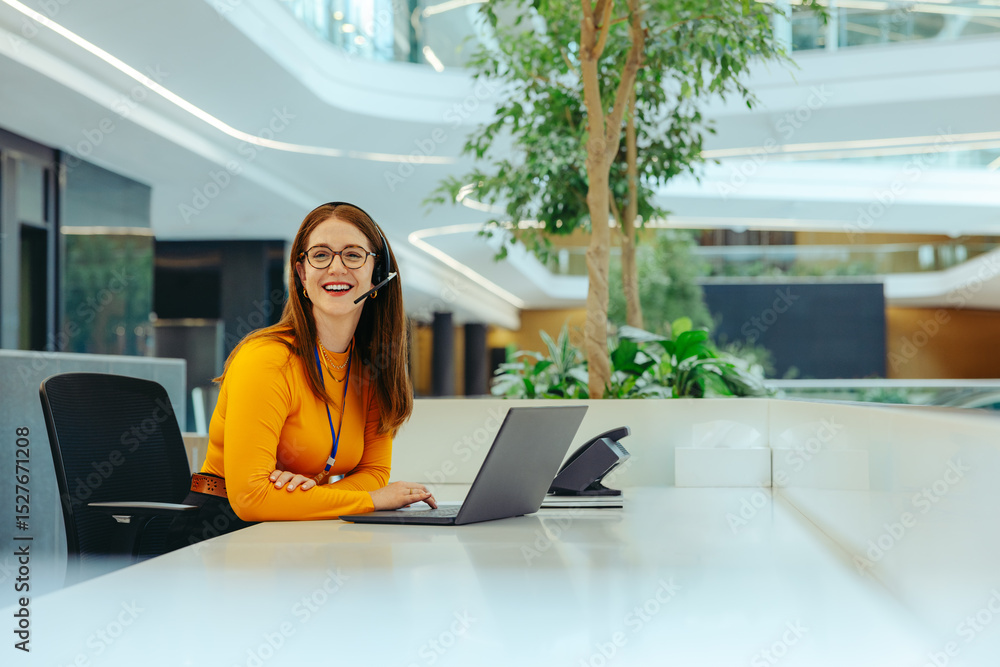 Receptionist in modern office environment with headset Stock Photo ...