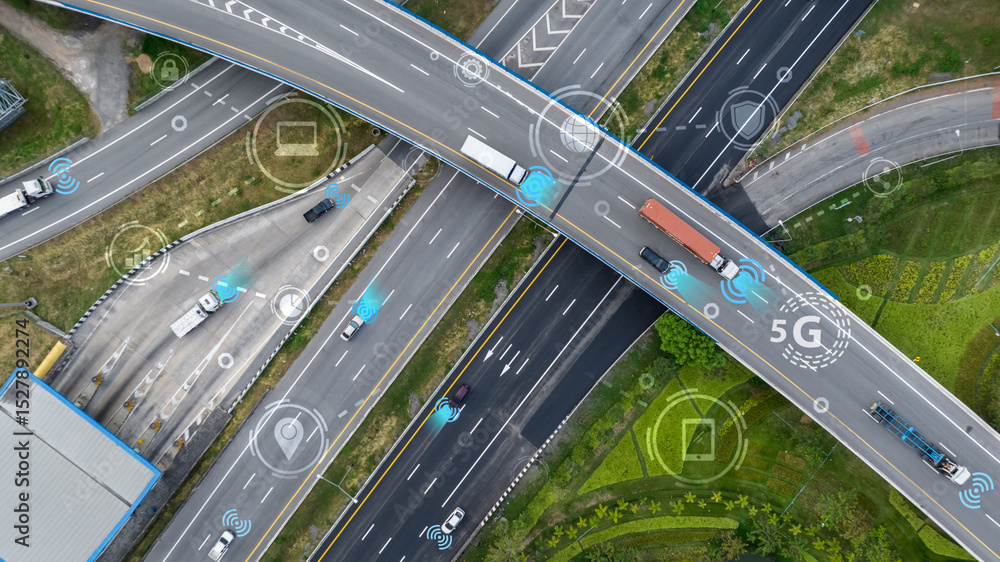 Aerial view of modern highway interchange with autonomous vehicles and ...