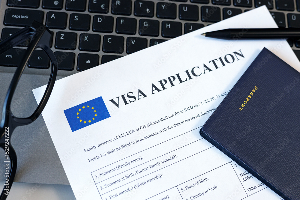 Schengen Visa application form and passport on computer. Application to ...