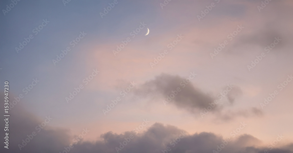 Photo of a crescent moon in sunset, extended using generative AI. The ...