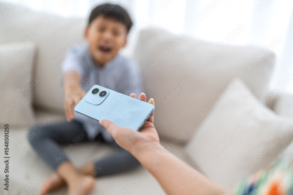 Child reaching for smartphone from parent, screen time control, tech ...