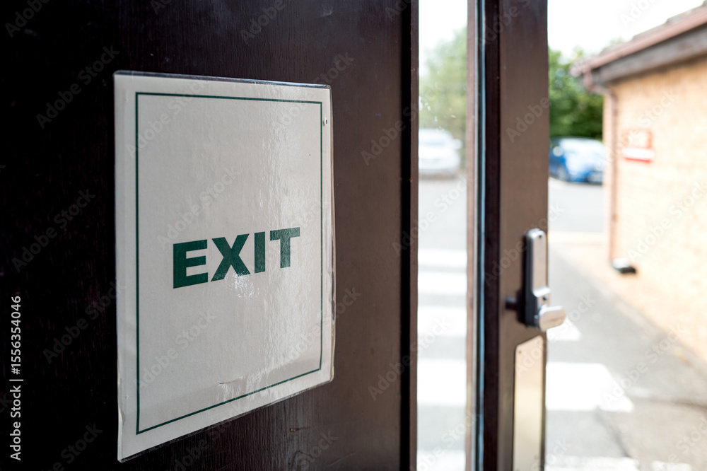 Large Exit sign seen on an emergency Fire Door within a typical NHS ...