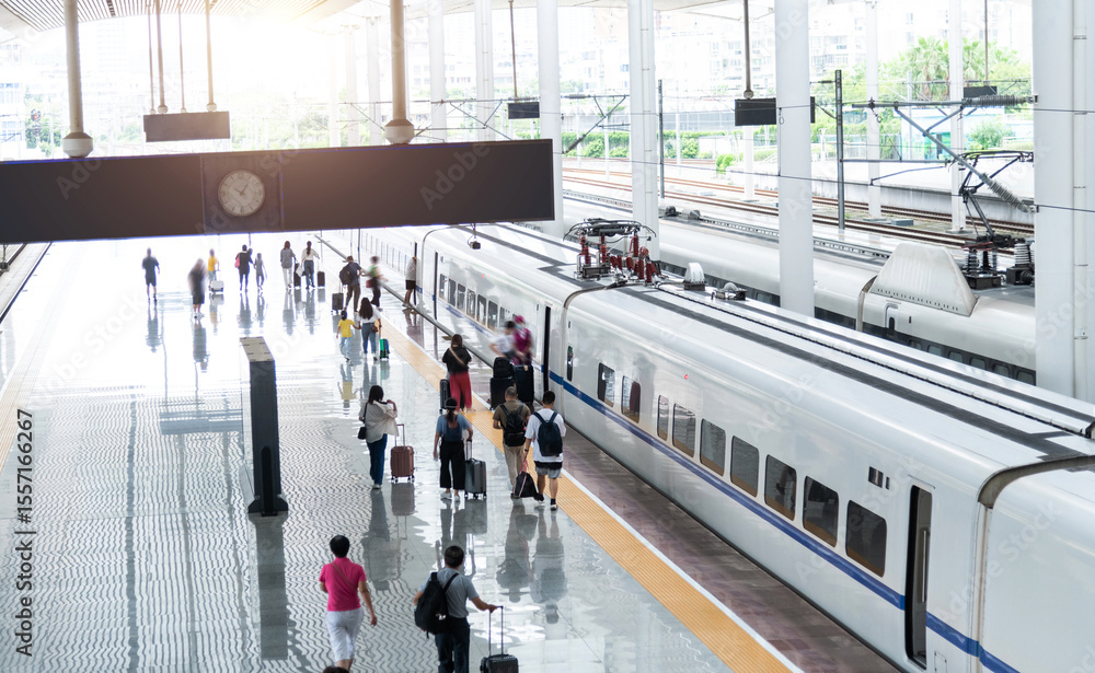 People walking on train station platform Stock Photo | Adobe Stock