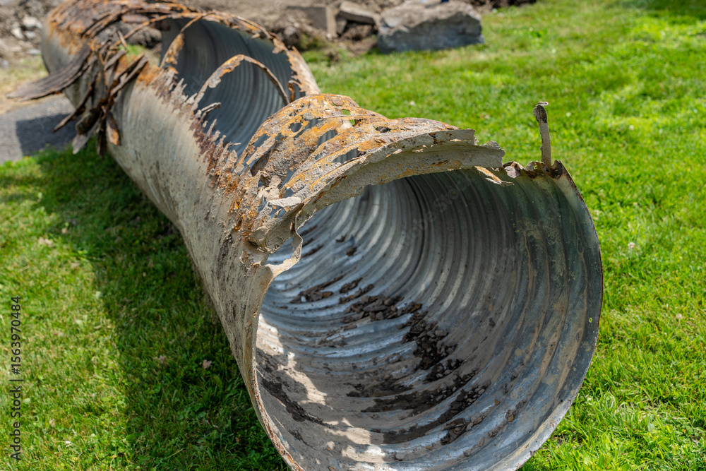 Infrastructure photo of rusted out corrugated metal pipe, CMP, drainage ...