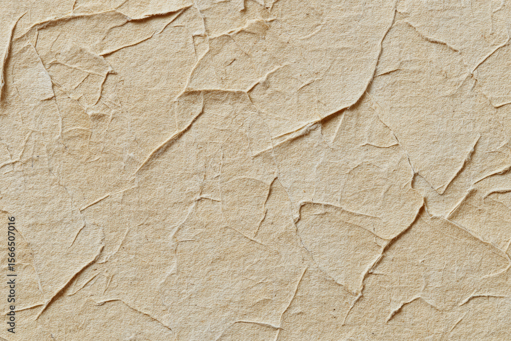 Textured beige paper surface with soft creases and subtle folds ...