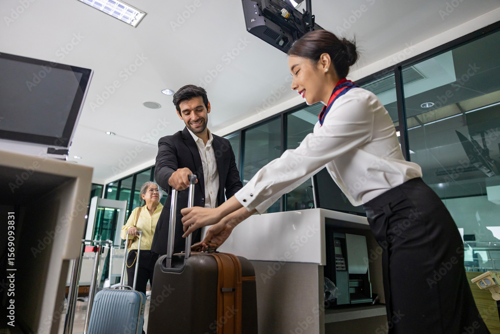 Caucasian businessman passenger is checking in big baggage bag to ...